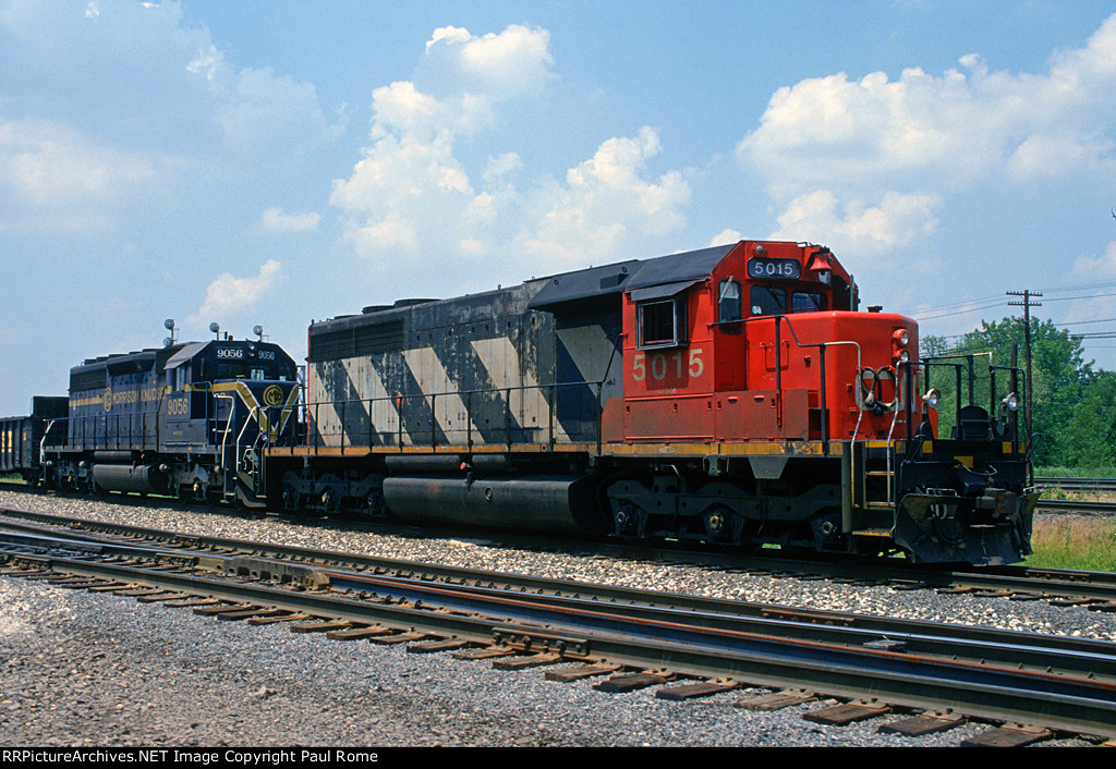 CN 5015, EMD SD40, and MKCX 9056, westbound on the BN at Eola Yard